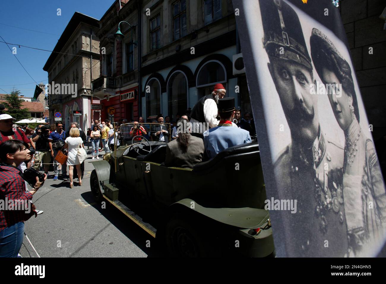 Tourists pose for photos inside a replica of the "Graf & Stift" car ...