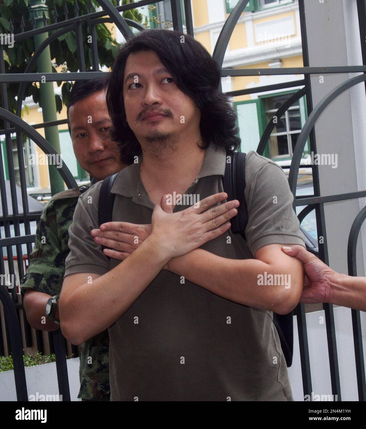 Sombat Boonngam-anong gestures a sign of freedom upon arriving at the ...