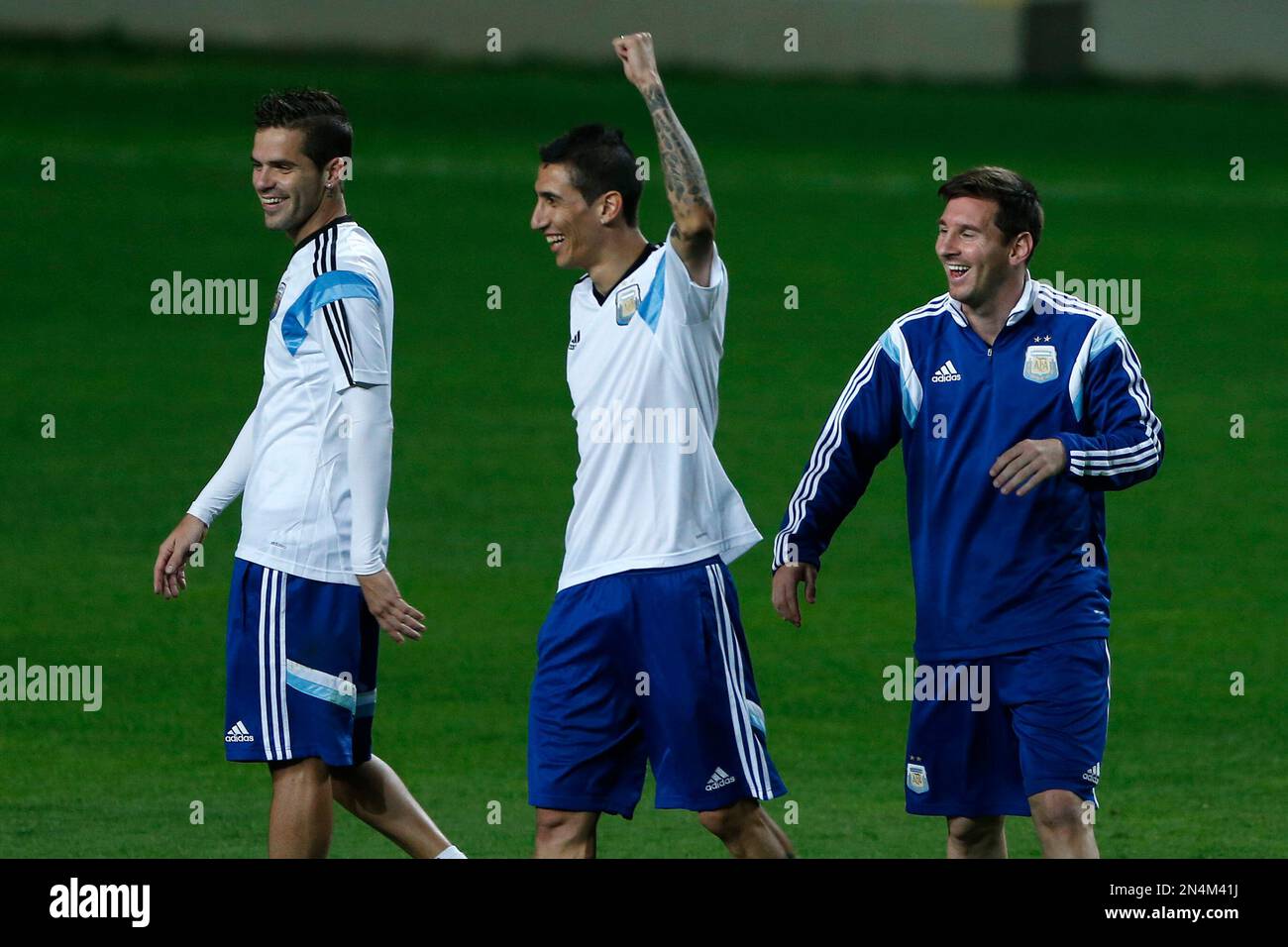 Argentina's Angel di Maria, center, raises his fist as he walks next to ...