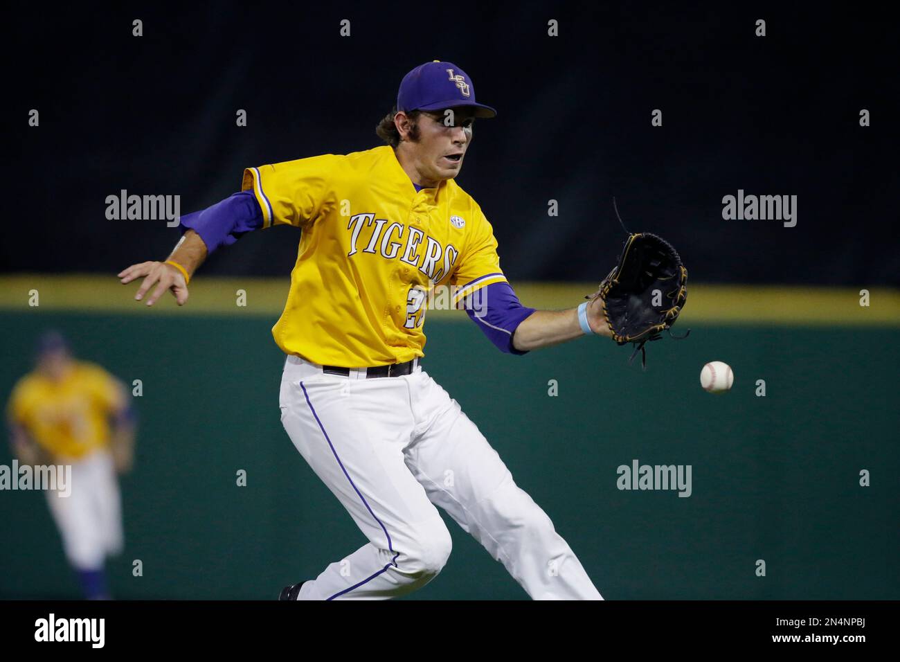 LSU infielder Conner Hale (20) chases a grounder single by Houston's ...