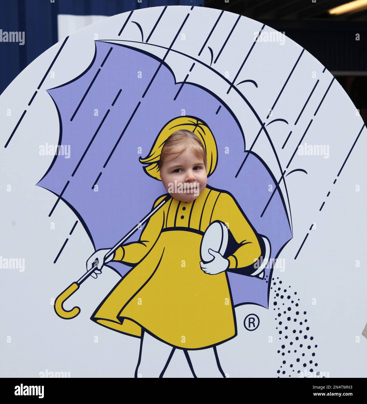 A child poses in a Morton Salt Girl cutout outside Wrigley Field on ...