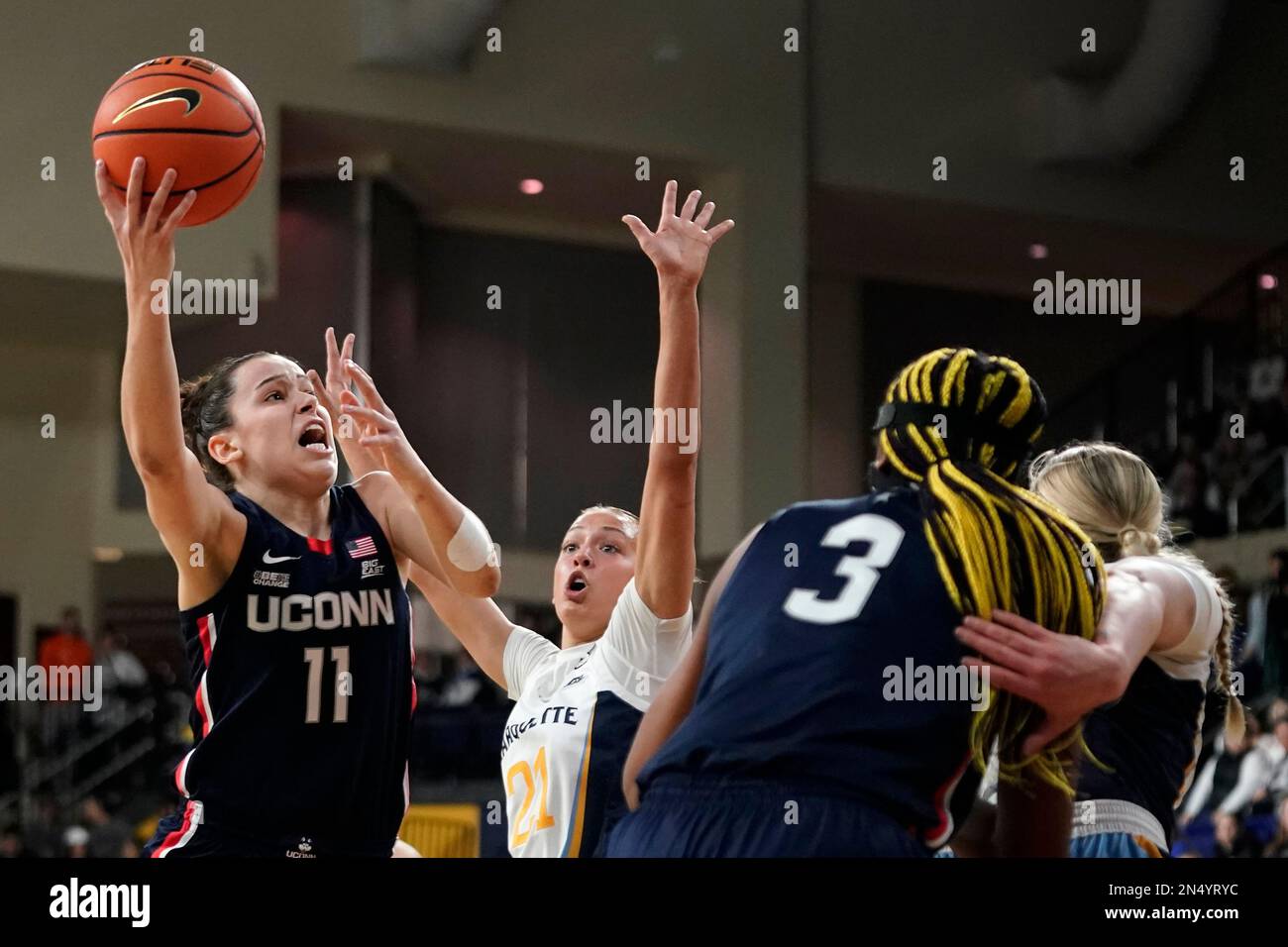 UConn's Lou Lopez Senechal (11) shoots past Marquette's Emily La ...