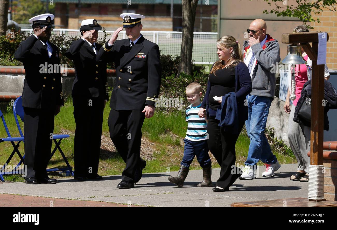 Jonielle Spillers, center, is escorted with her son Jacob and other ...