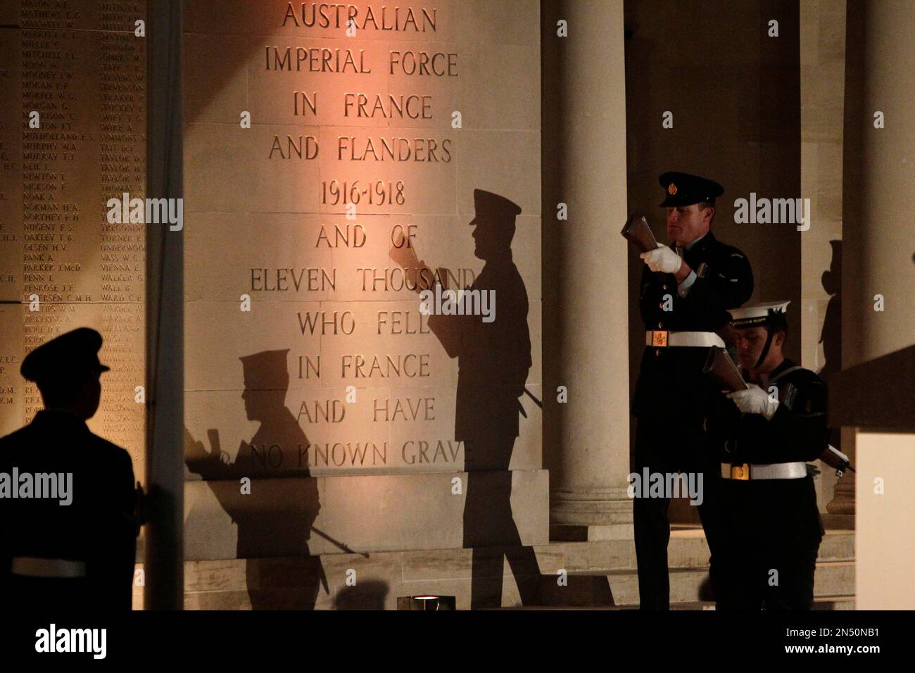 The shadow of an Australian soldier is cast on a monument for fallen ...