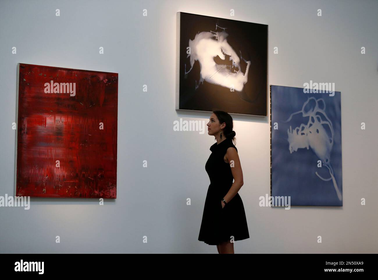A Christie's employee poses with a painting 'Abstraktes Bild' by ...