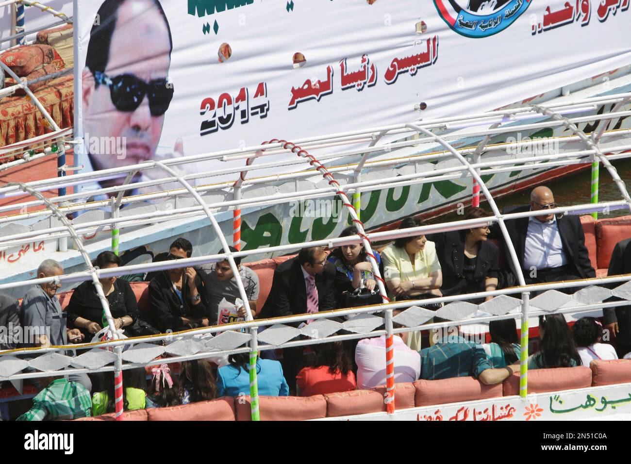Egyptian holiday makers ride in a boat on the Nile River marking Sham ...