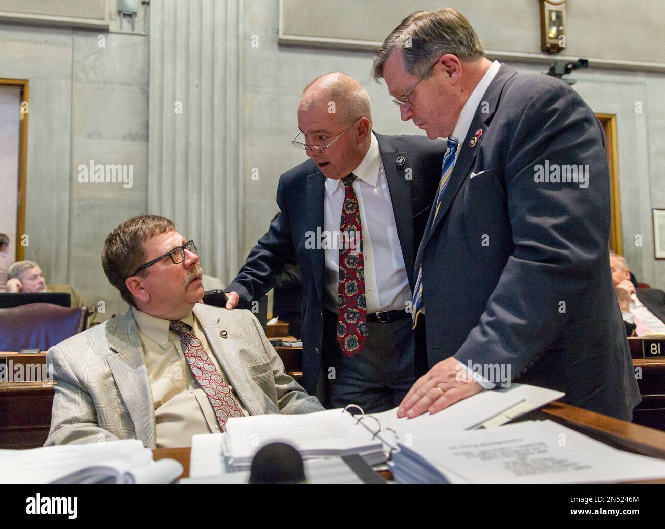 Lawmakers confer during a break in a House floor session in Nashville ...