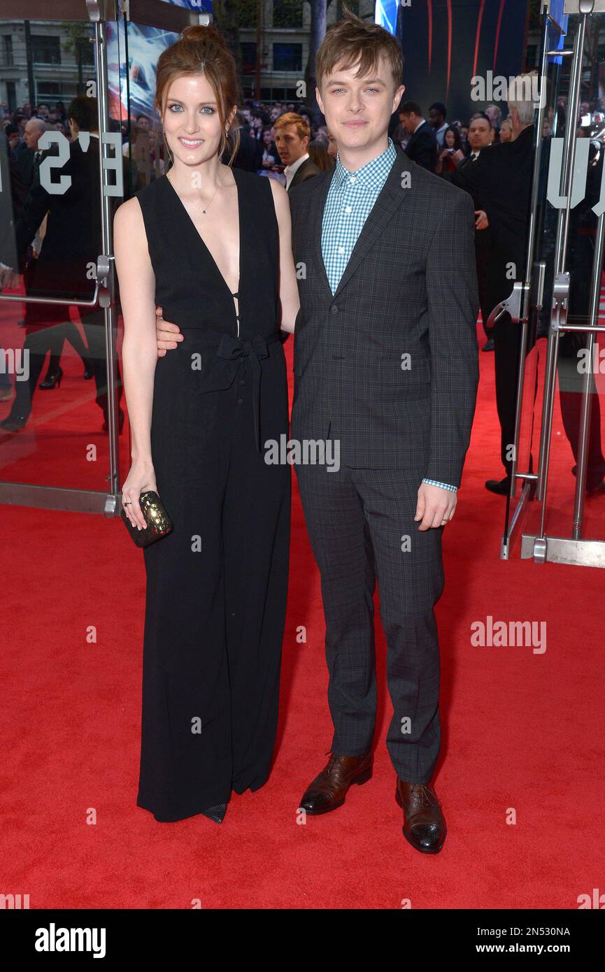 Actress Anna Wood and actor Dane DeHaan pose for photographers as they ...