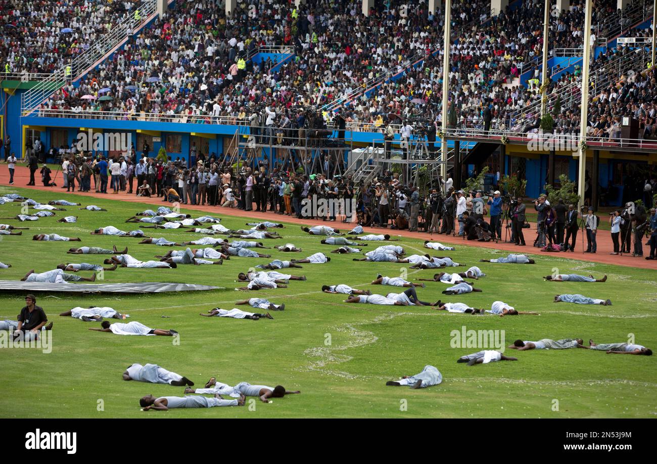 Performers re-enact the events at a public ceremony to mark the 20th ...
