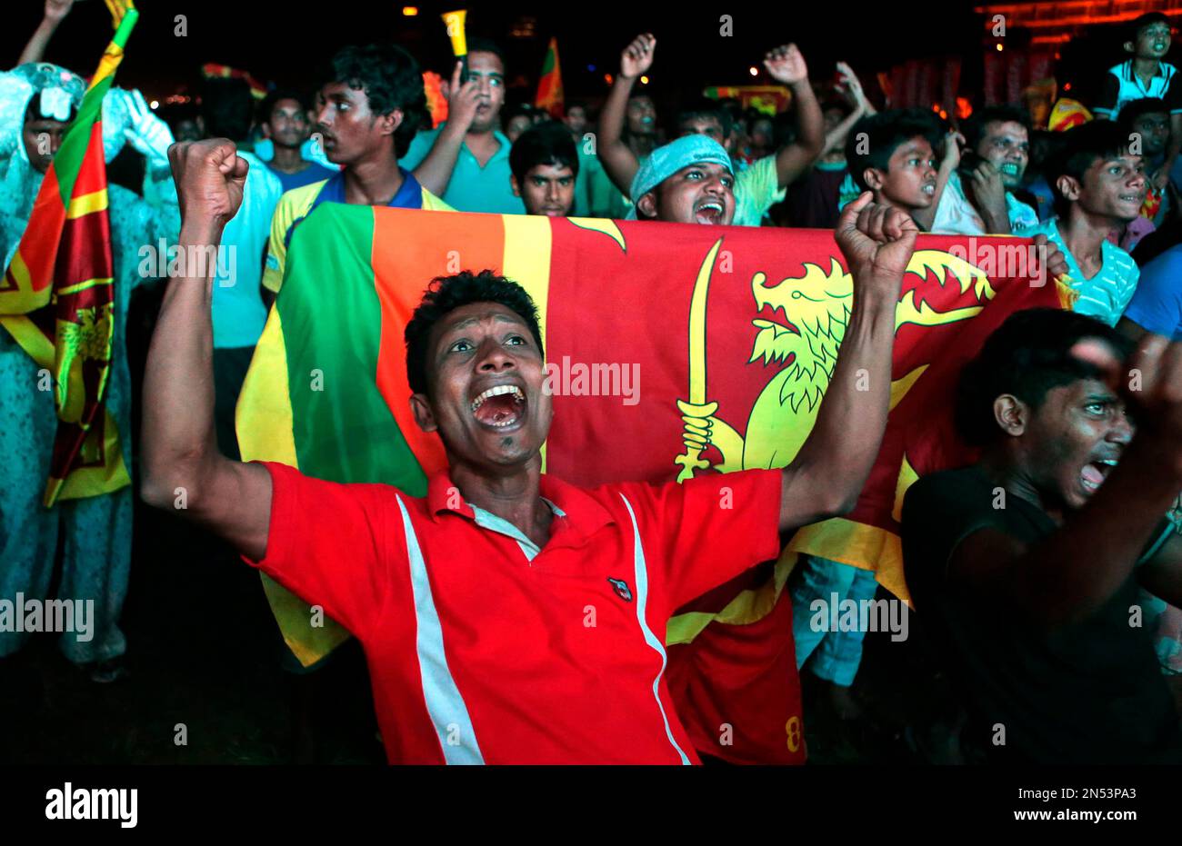 Sri Lanka cricket fans carry their national flag in Colombo, Sri Lanka ...