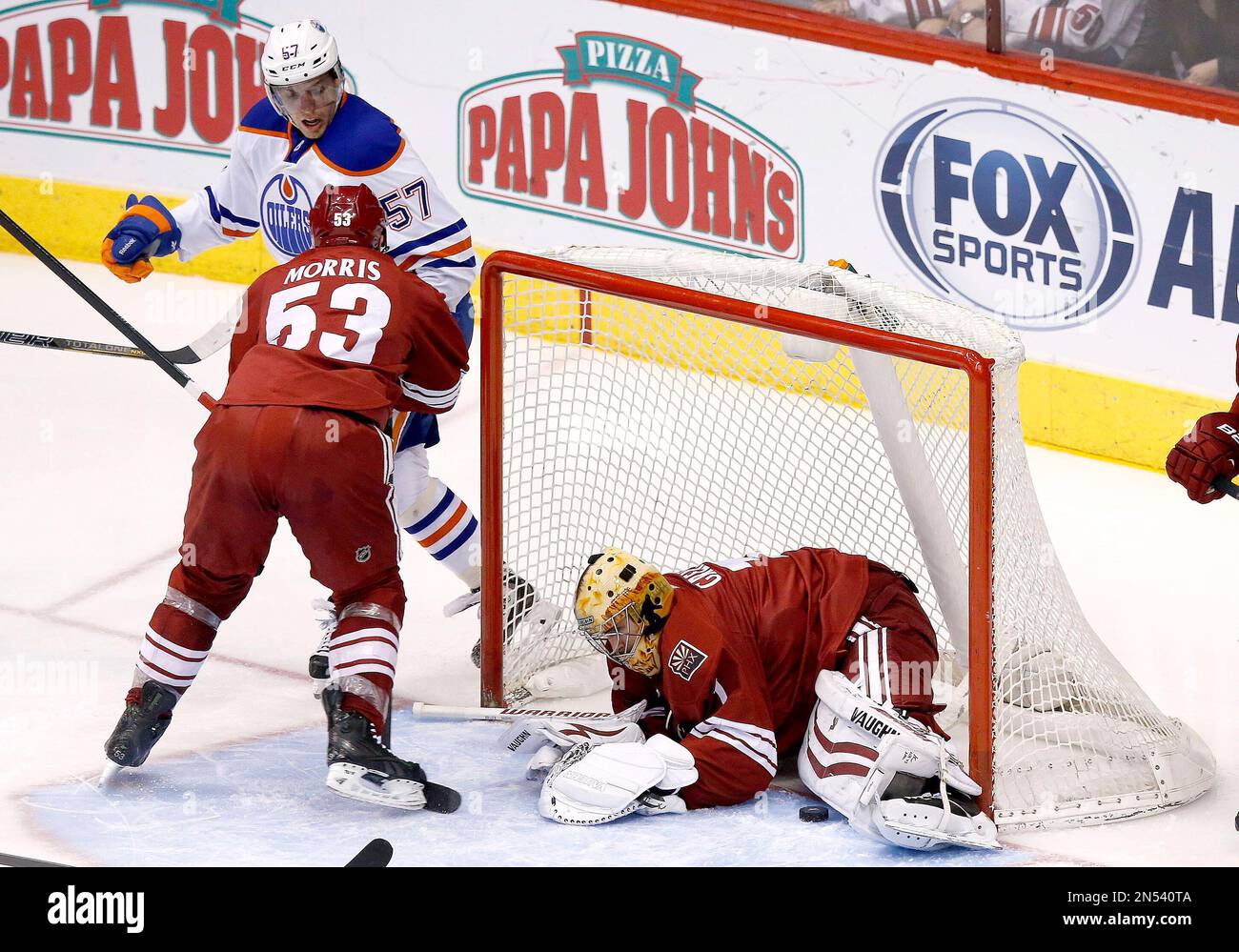 Phoenix Coyotes' Thomas Greiss, right, of Germany, makes a save on a ...