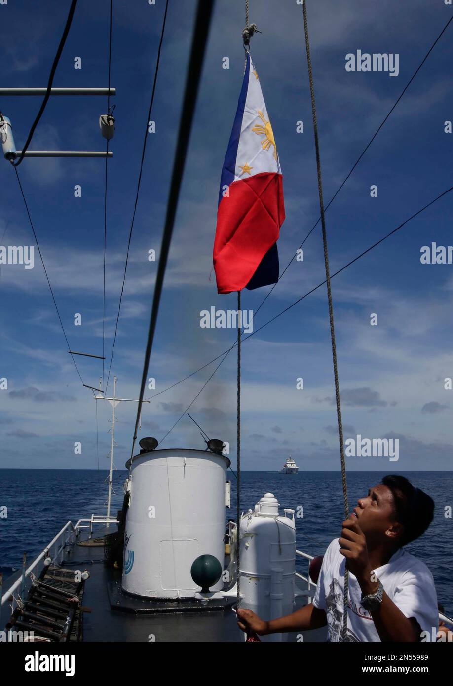 A Philippine Marine aboard the Philippine Government vessel AM700 ...