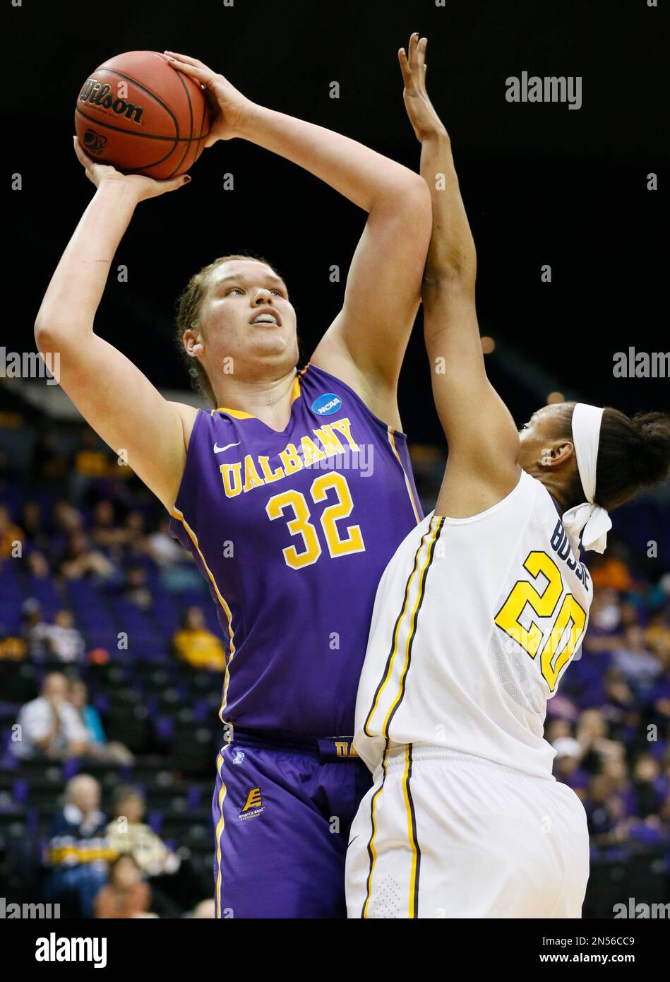 Albany center Megan Craig (32) attempts a shot at the basket while West ...