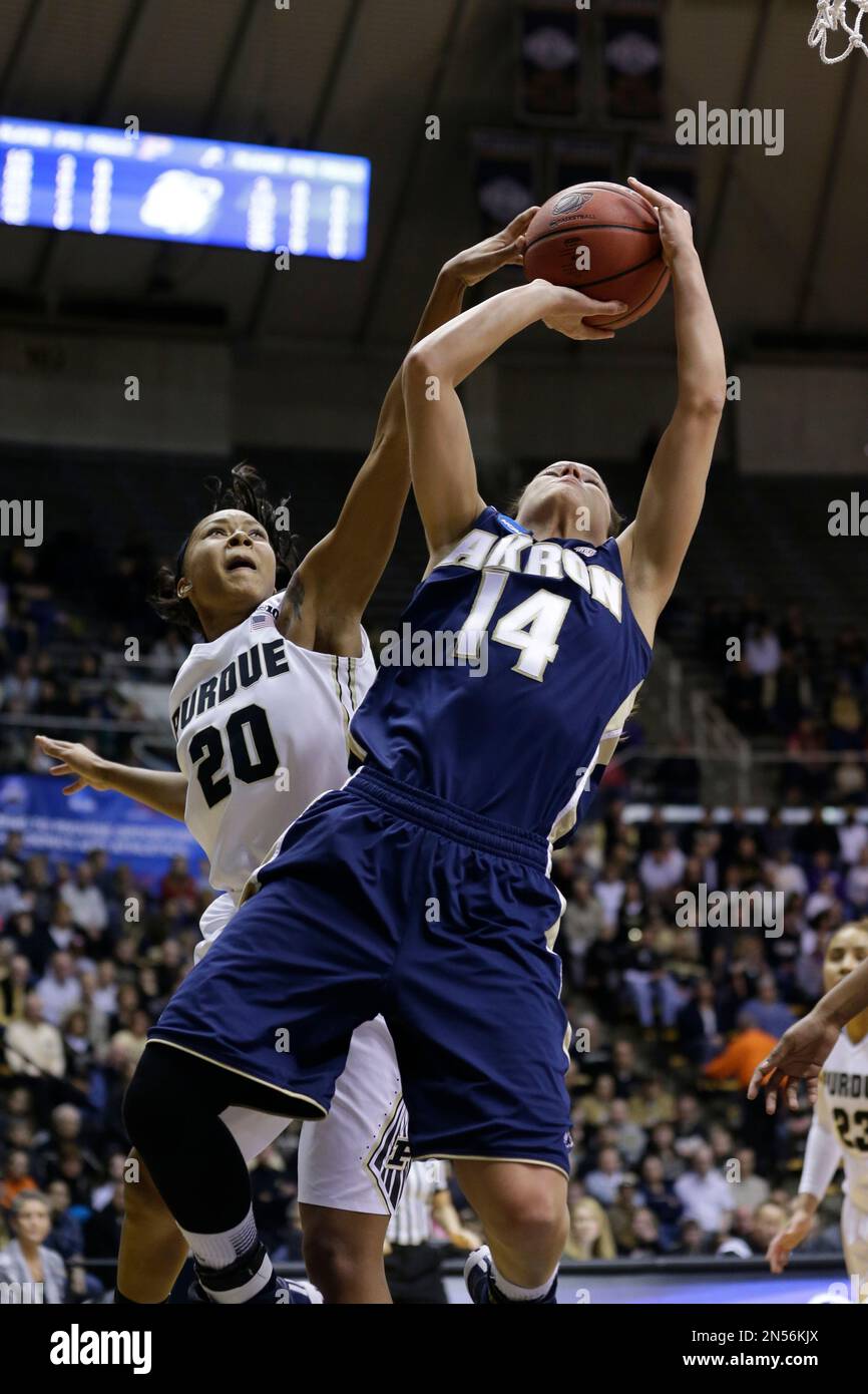 Akron guard Hanna Luburgh (14) and Purdue guard Dee Dee Williams go up ...
