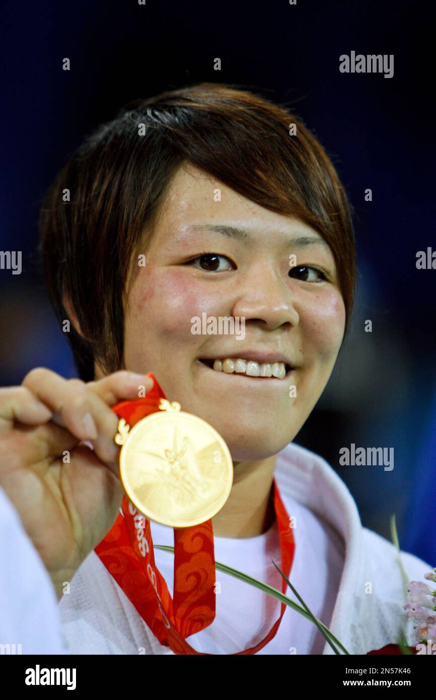 FILE - In this Aug. 12, 2008 file photo, Japanese gold medalist Ayumi Tanimoto stands with her ...