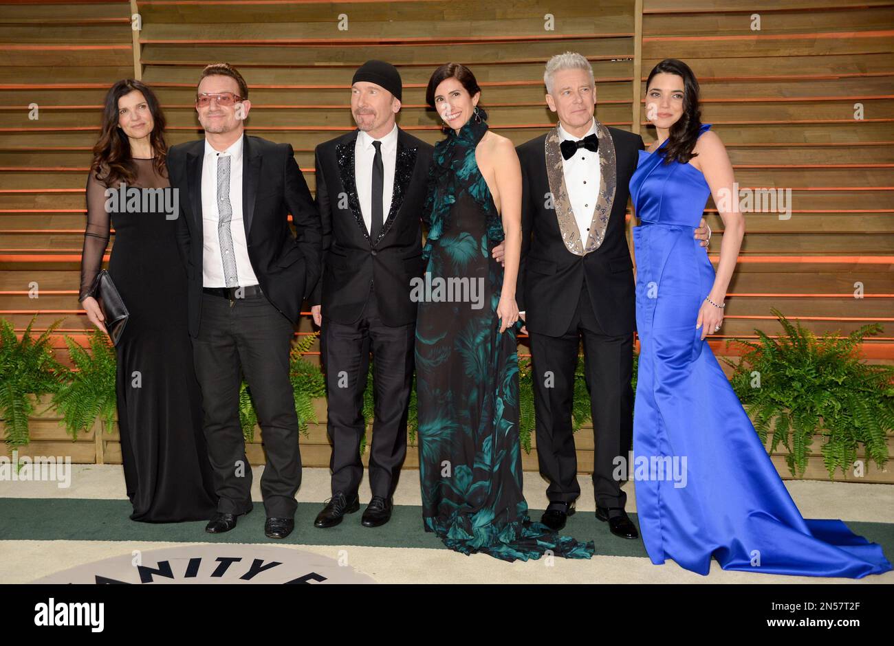 Bono and his wife Ali Hewson, left, Edge and his wife Morleigh ...