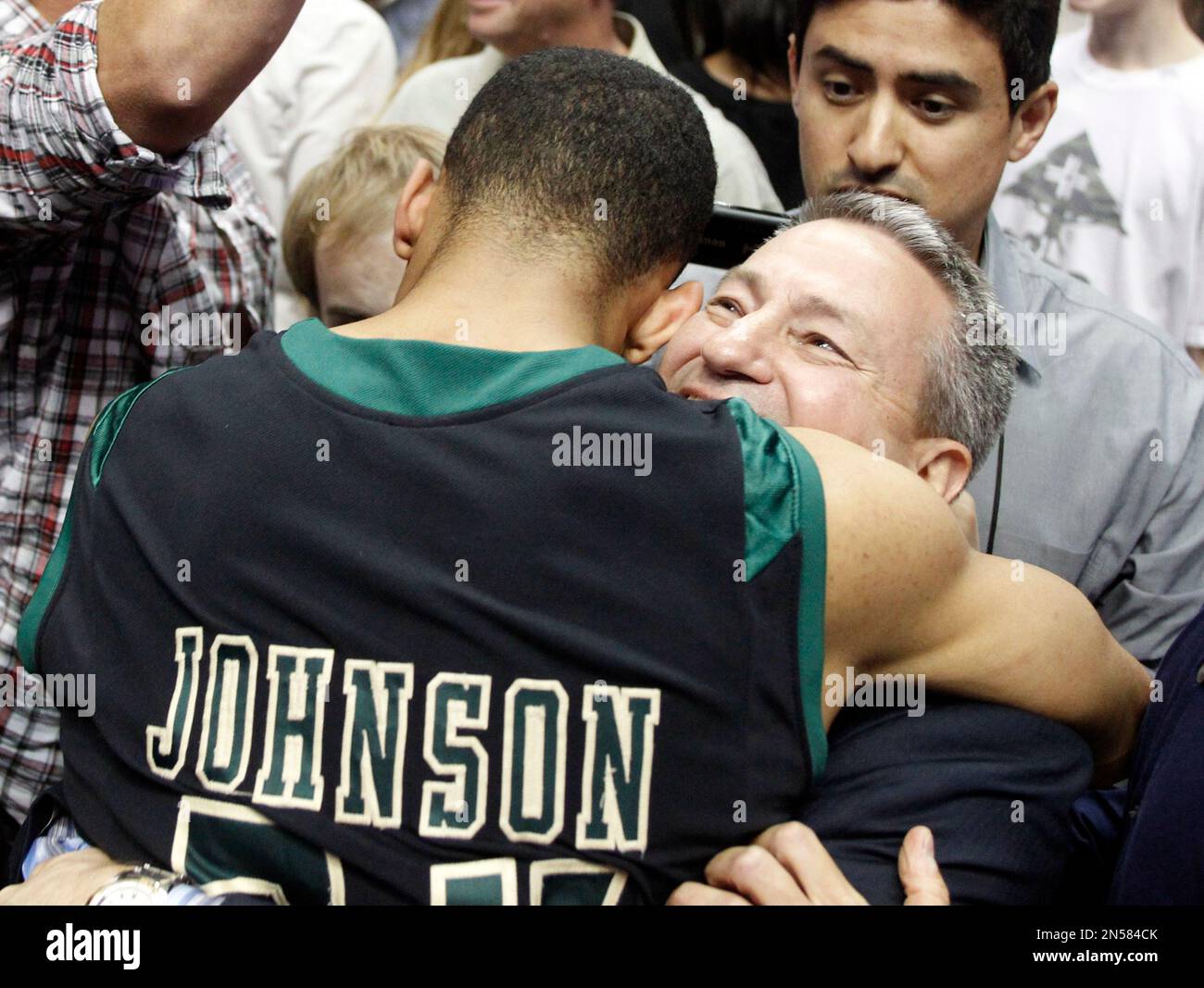 Cal Poly head coach Joe Callero, right, celebrates with Cal Poly guard ...