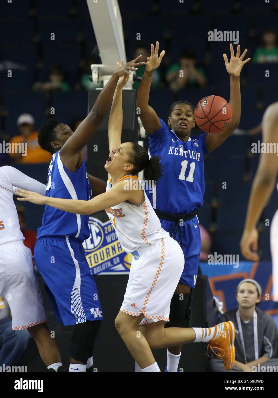 Tennessee forward Cierra Burdick, center, gets her shot blocked by ...