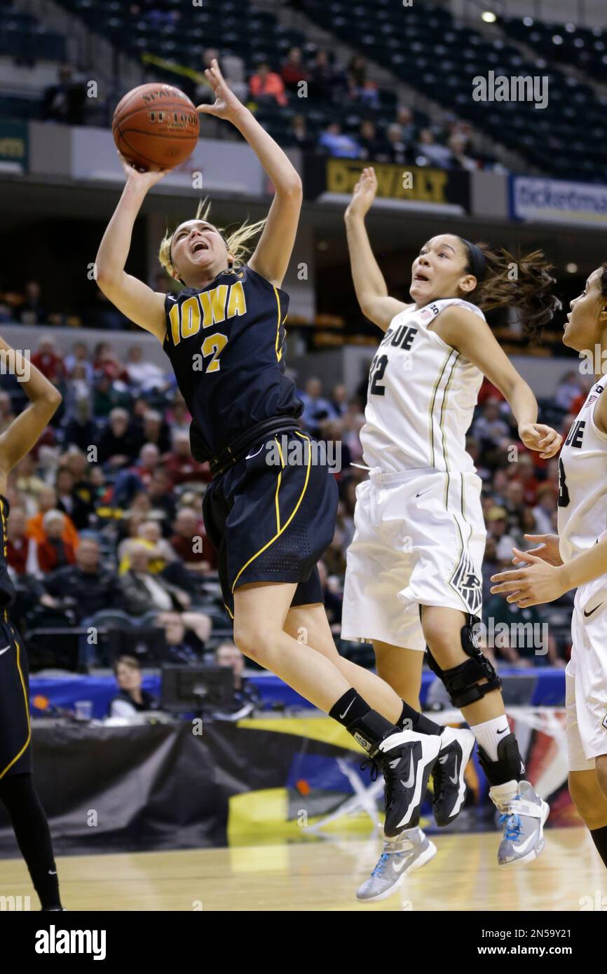 Iowa guard Ally Disterhoft, left, shoots in front of Purdue forward ...
