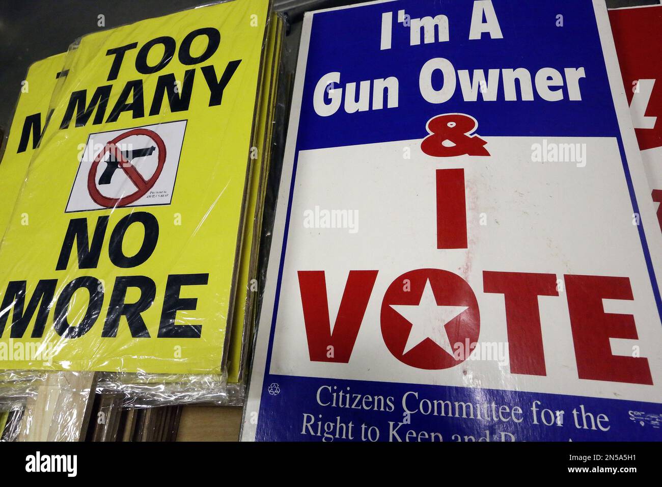 Signs supporting concealed carry legislations are stacked before being ...