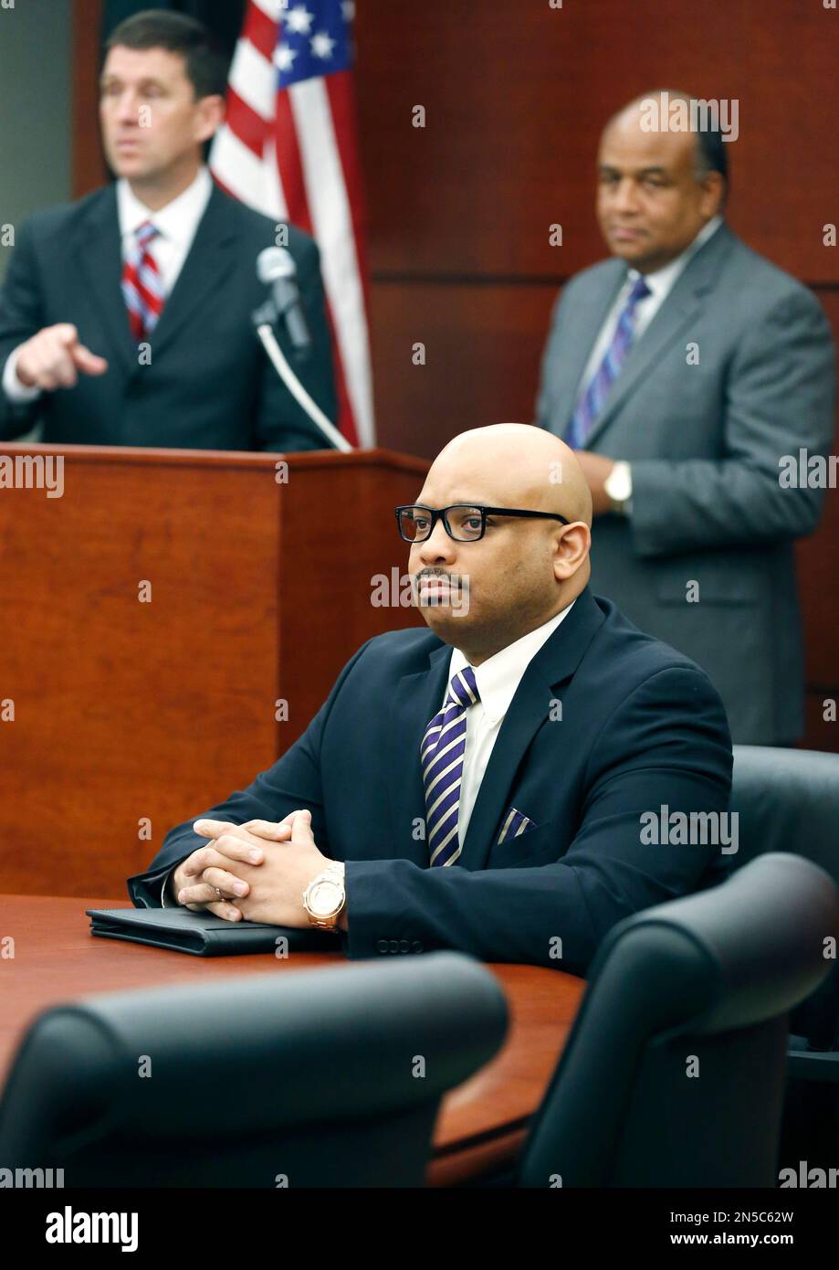 State Commissioner of Higher Learning Hank Bounds, rear left, and ...