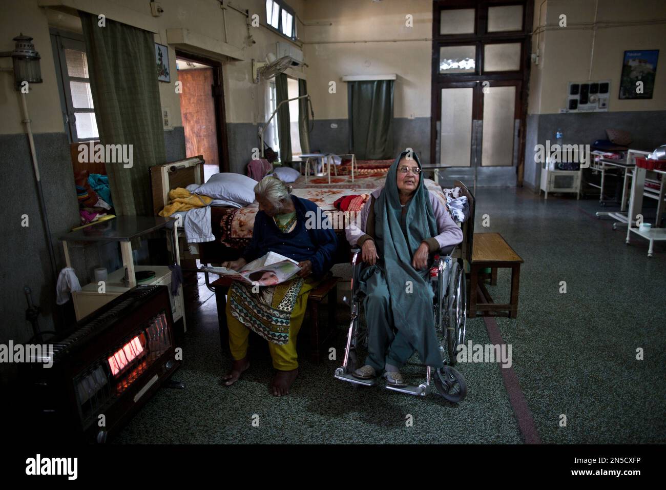 In this Saturday, Feb. 15, 2014, photo, Eldery Pakistani patients and ...