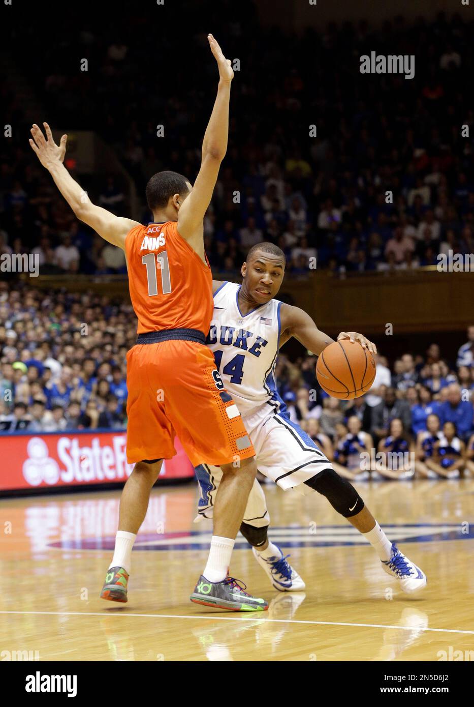 Duke's Rasheed Sulaimon (14) dribbles around Syracuse's Tyler Ennis (11 ...