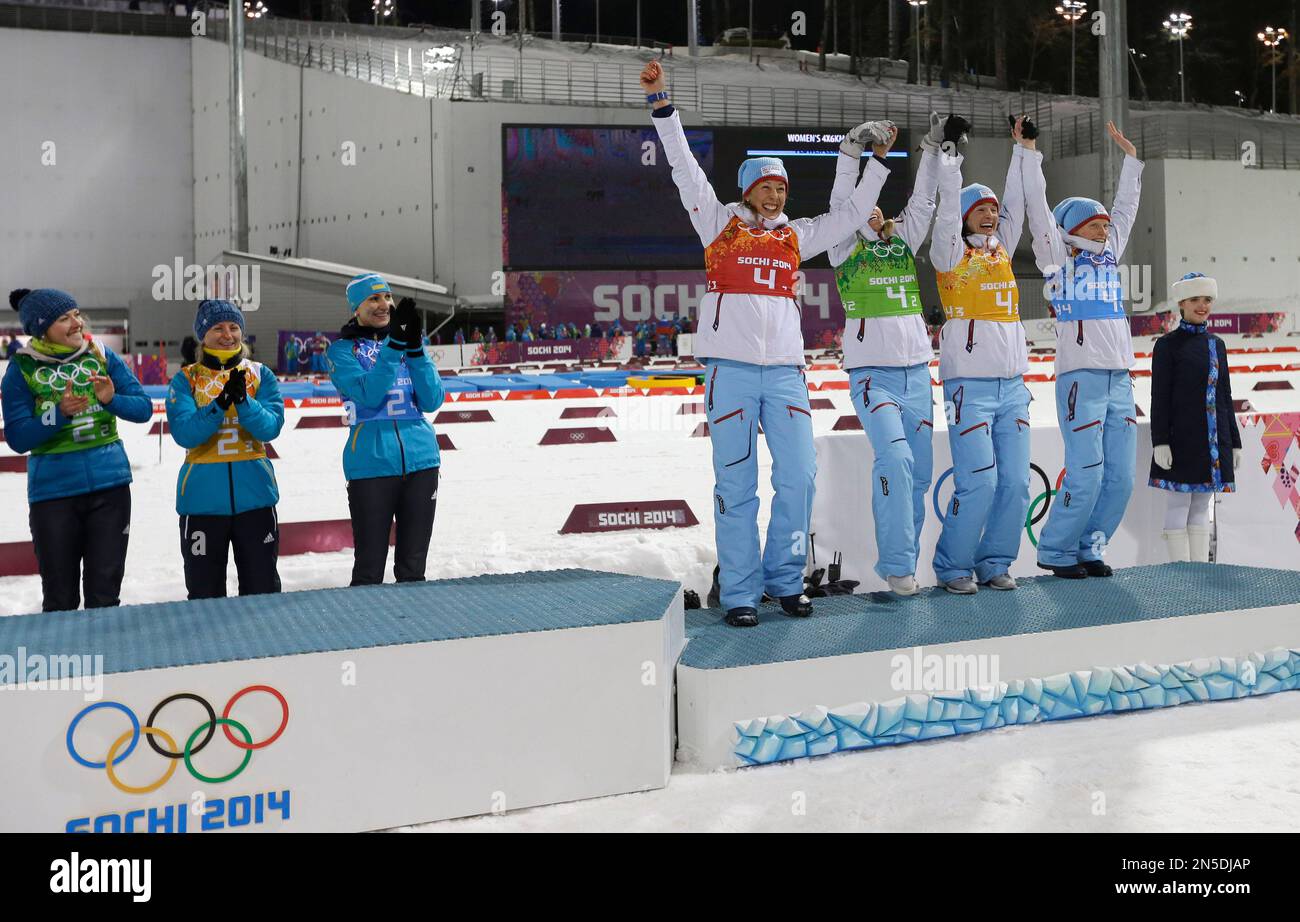 Ukraine's Juliya Dzhyma, Valj Semerenko and Olena Pidhrushna applaud as ...