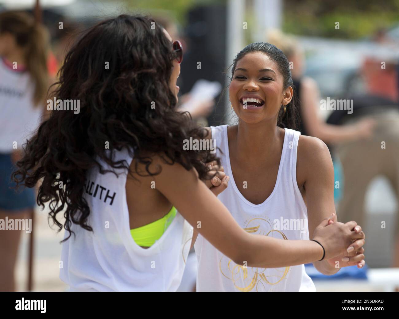 Ariel Meredith, left, and Chanel Iman celebrate a point as a dozen ...