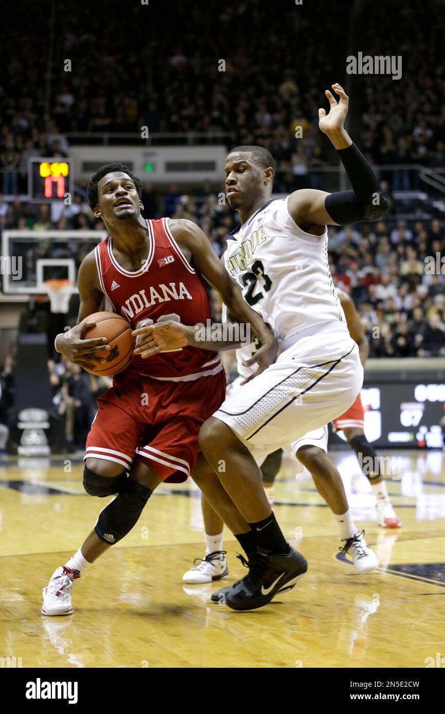 Indiana guard Stanford Robinson, left, drives on Purdue forward Jay ...