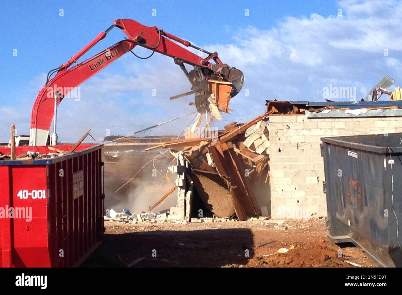 An excavator tears down a former Little Axe Public Schools' middle ...