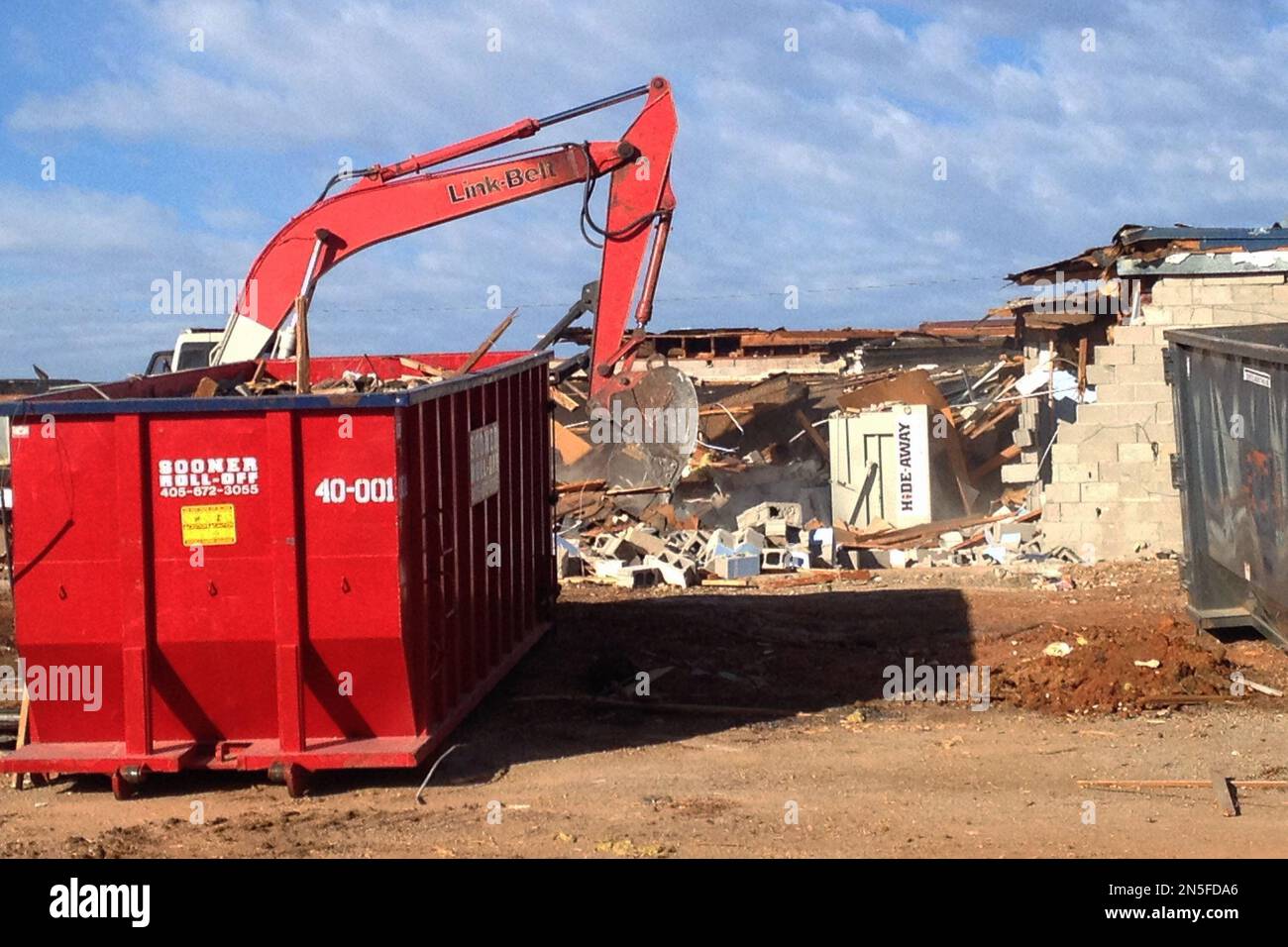 An excavator tears down a former Little Axe Public Schools' middle ...