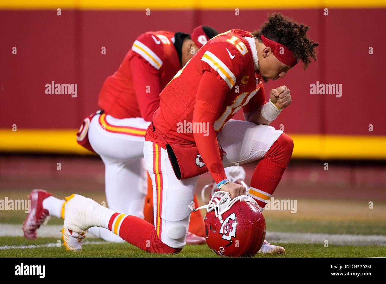 FILE - Kansas City Chiefs quarterback Patrick Mahomes prays before the ...