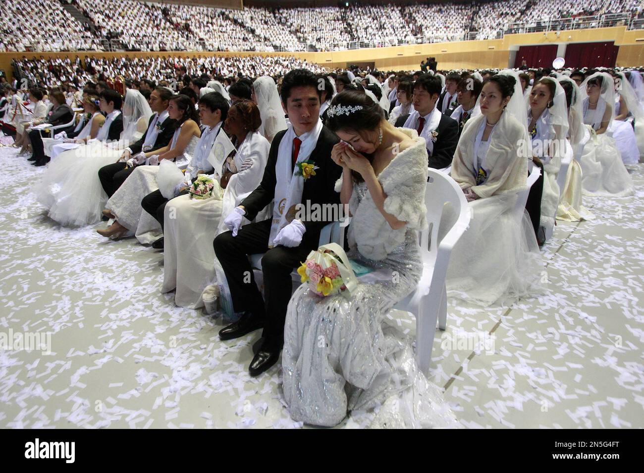 A bride weeps in a mass wedding ceremony at the CheongShim Peace World ...
