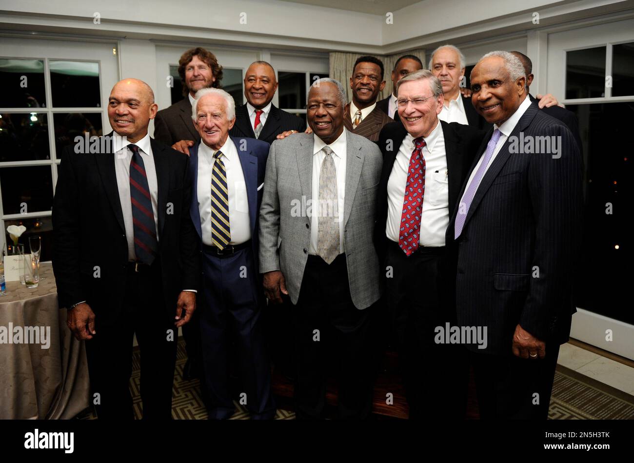 Baseball Hall of Famer Hank Aaron, center, poses with from front right ...