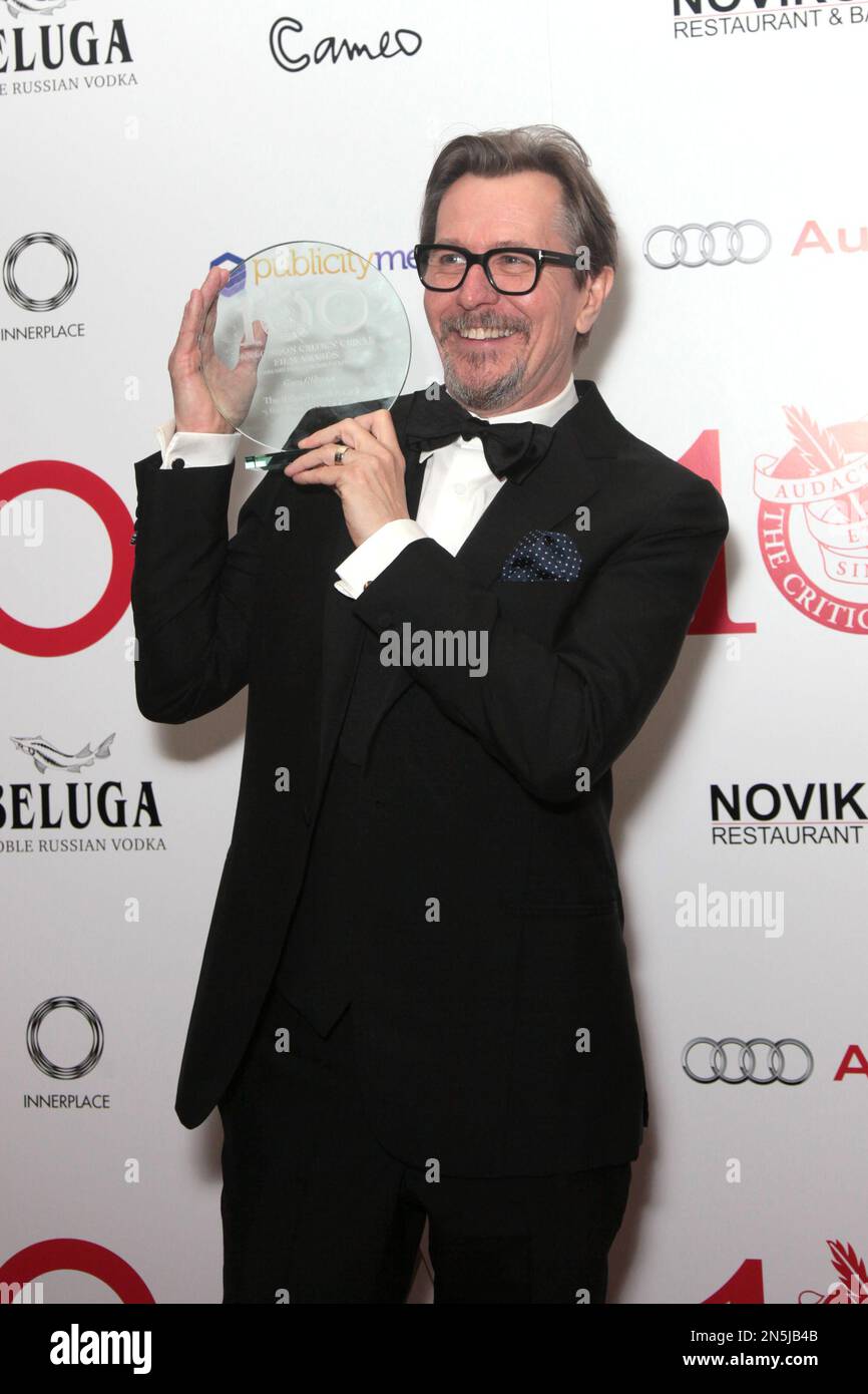 British actor Gary Oldman hold his award Dilys Powell Award for ...