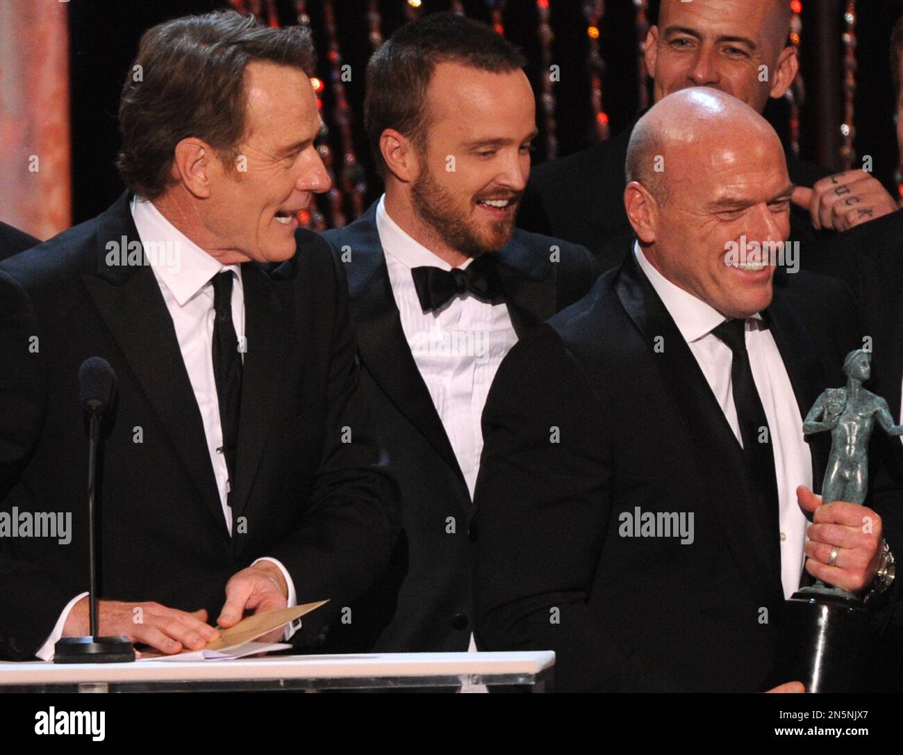 From left, Bryan Cranston, Aaron Paul and Dean Norris accept the award ...