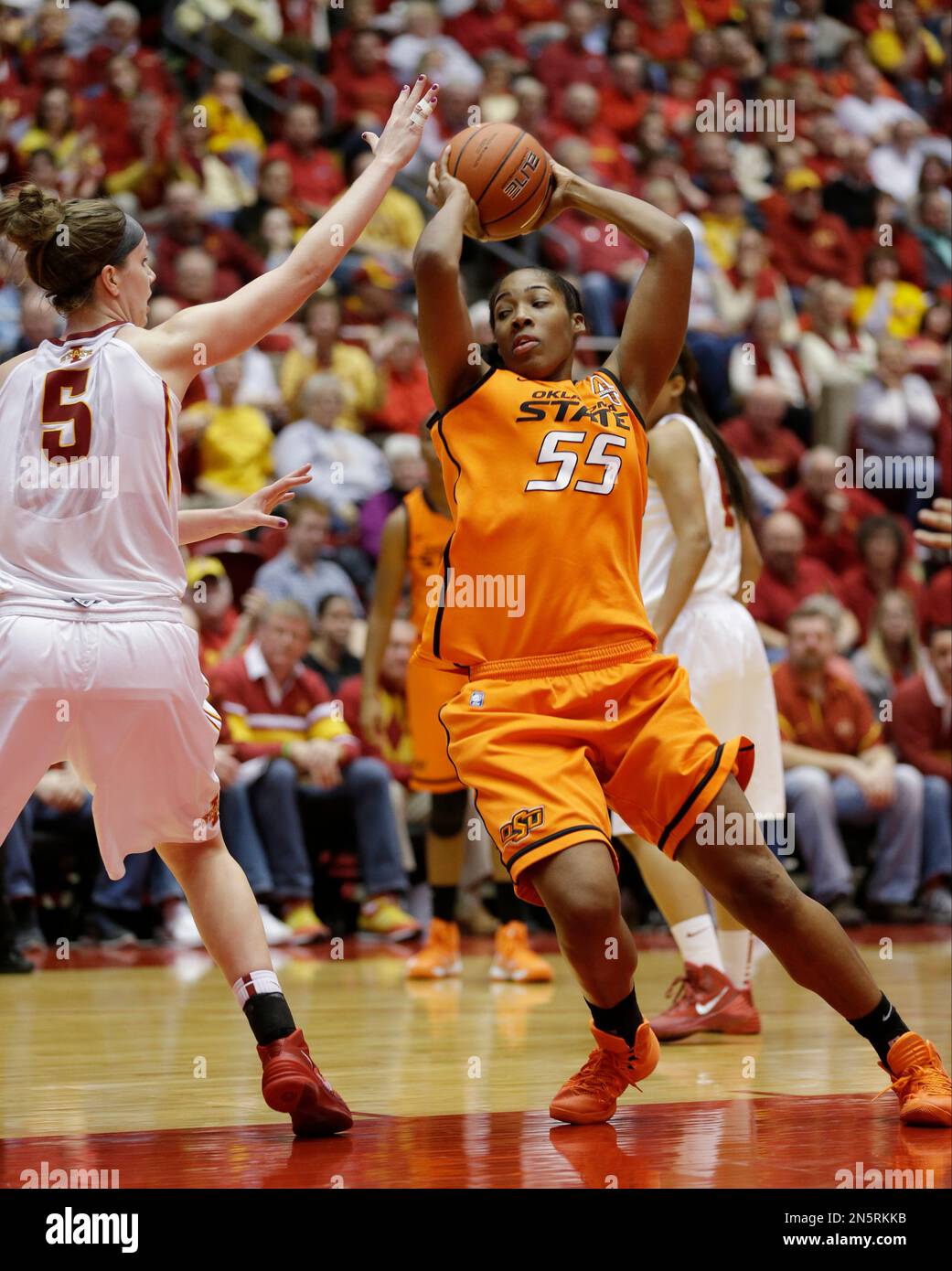 Oklahoma State center LaShawn Jones, right, drives around Iowa State ...