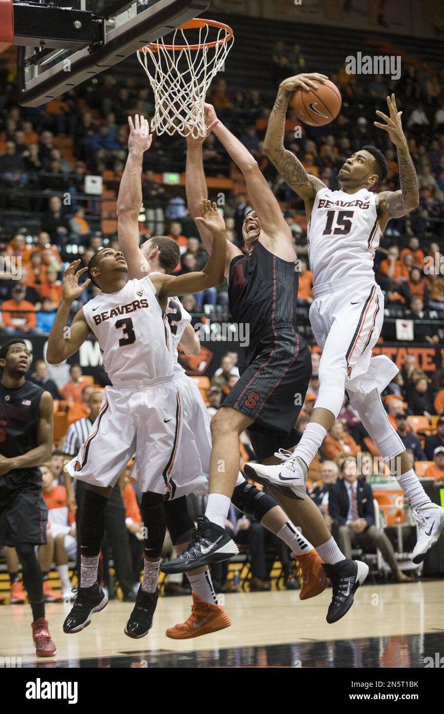 Oregon State forward Eric Moreland, right, pulls down a rebound over ...