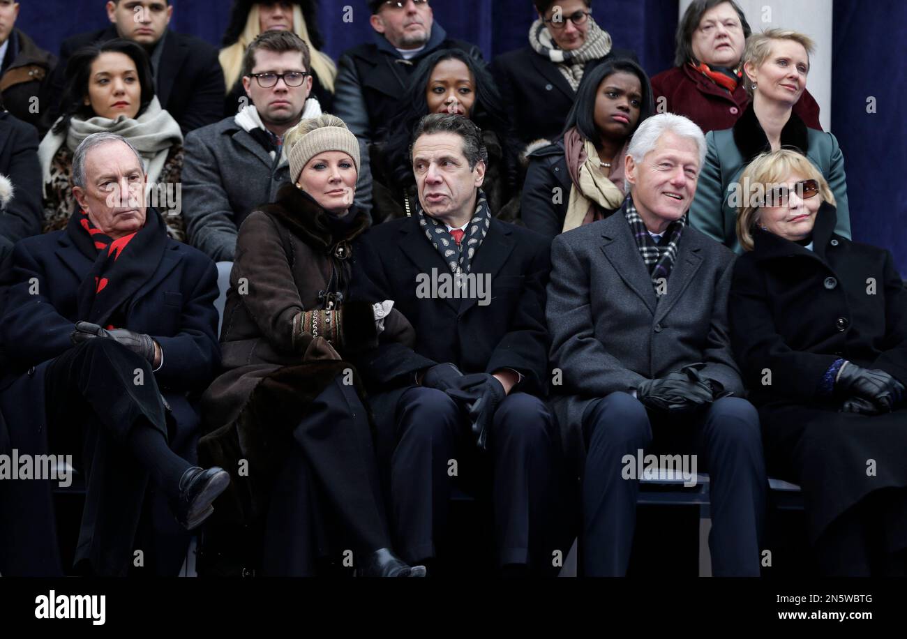 Former Secretary of State Hillary Clinton, right, her husband and ...
