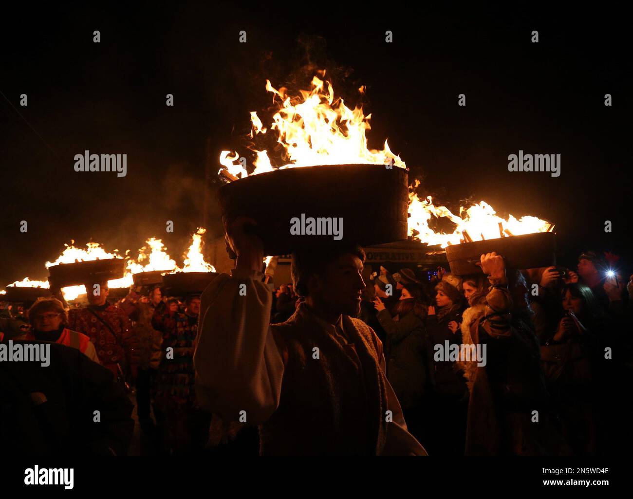 The Allendale tar barrel men carry the burning whiskey barrels on their ...