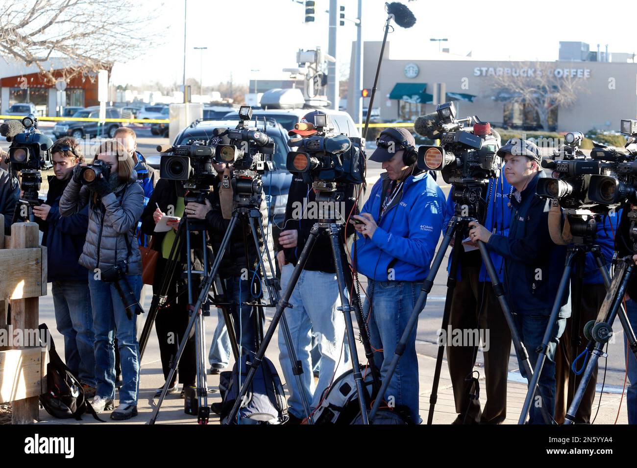 Media cover a briefing by Arapahoe County Sheriff Grayson Robinson ...