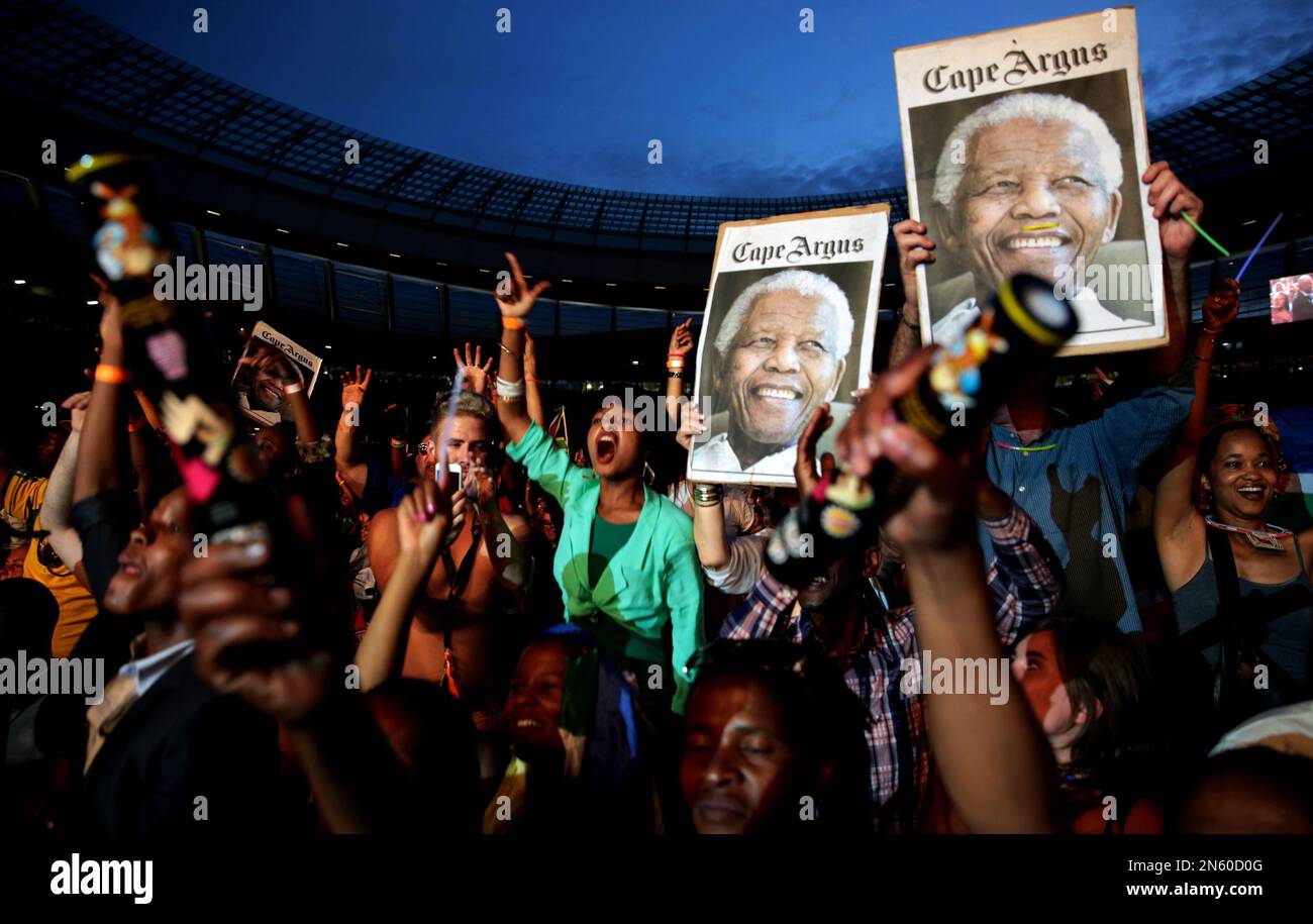 People sing and dance during the concert, Nelson Mandela: A Life ...