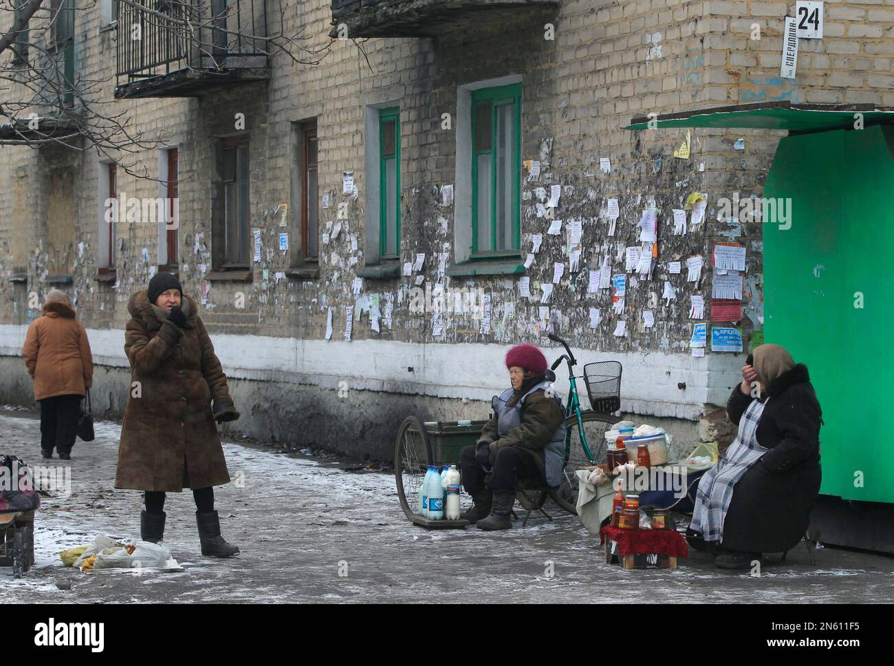 In this Friday, Dec. 6, 2013 photo Ukrainian street vendors sell home ...