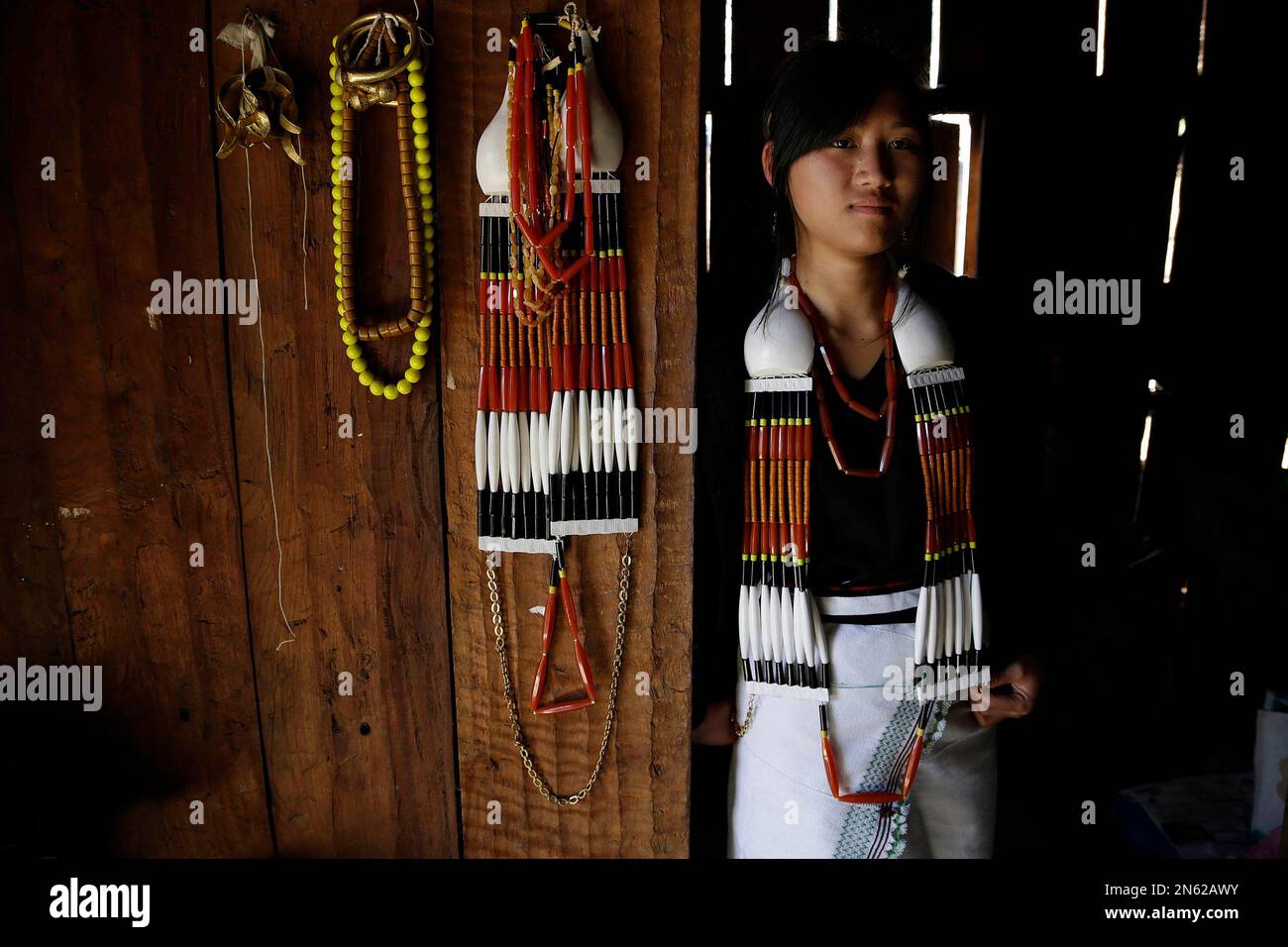 A Naga tribal woman in traditional attire gets ready for a performance ...