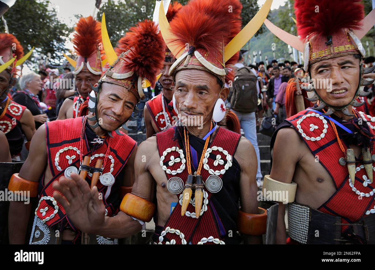 Naga tribal people in traditional attire wait to perform a dance during ...