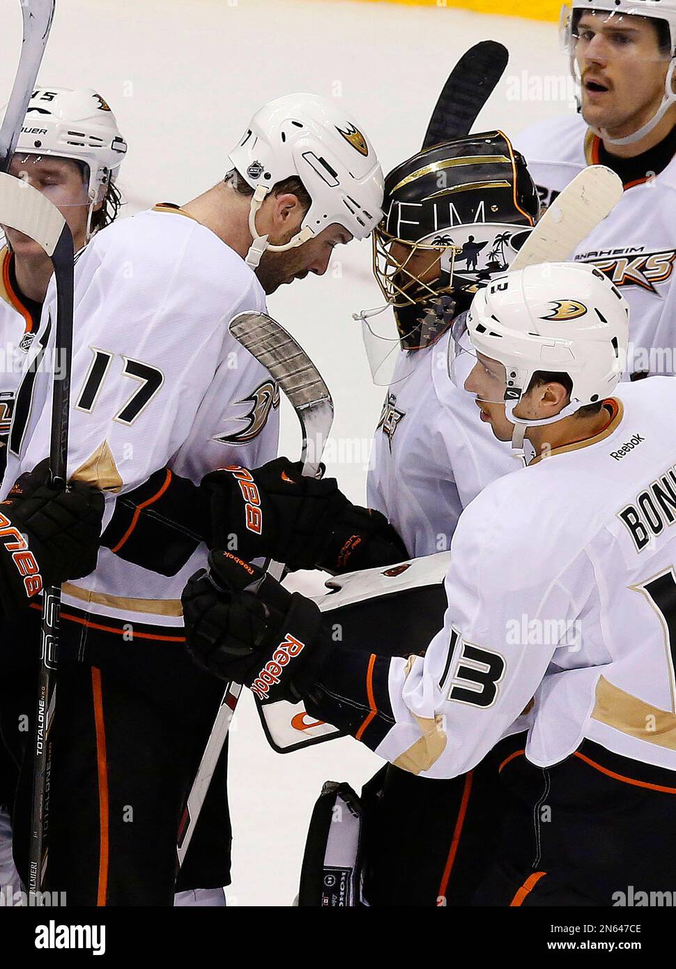 Anaheim Ducks' Dustin Penner (17) touches the face mask of goalie Jonas ...