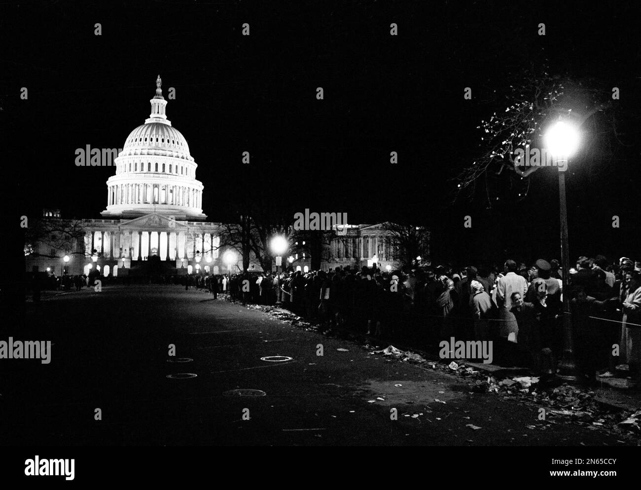 FILE - In this Sunday, Nov. 24, 1963 file photo, mourners stand in a ...