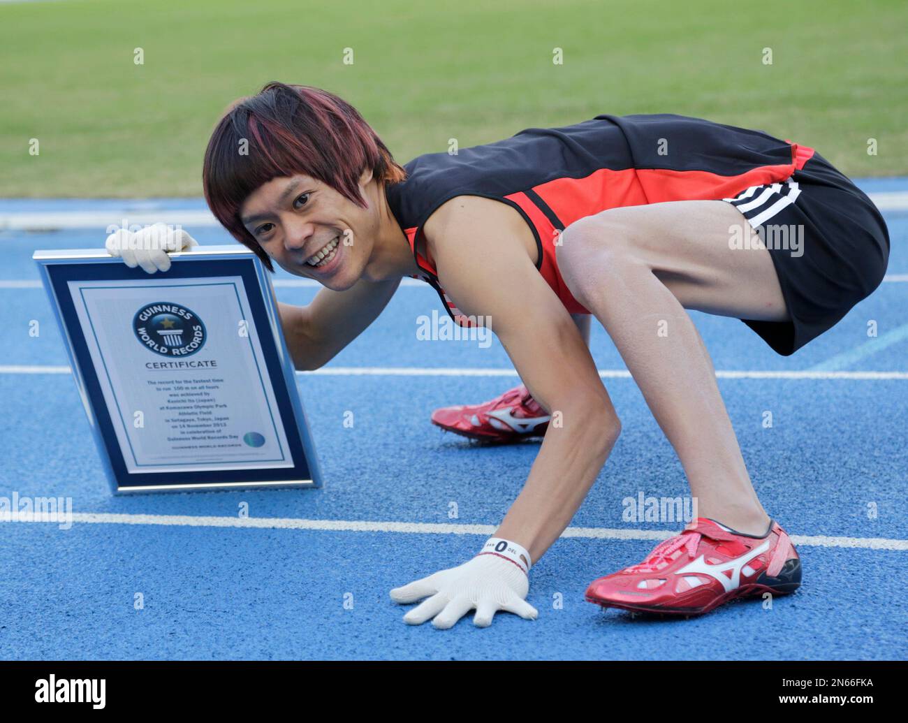Kenichi Ito poses for photographers with a Certificate of the Guinness World Records after ...