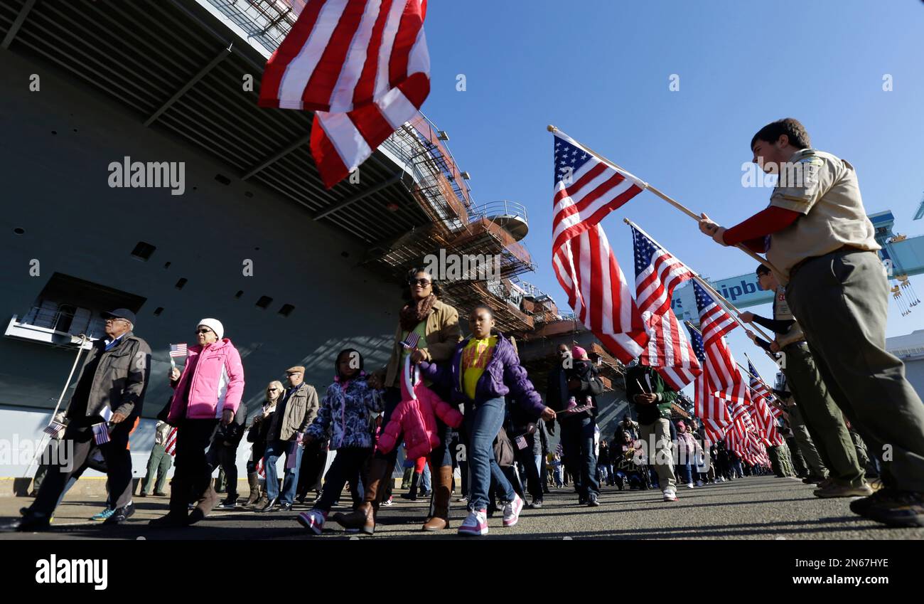 An honor guard of boy scouts from the local area and Michigan welcome ...